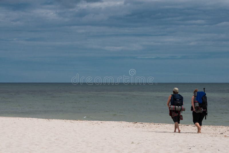 Backpacker at the beach editorial photography. Image of coast - 86962332