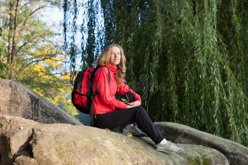 Backpacker Enjoying Relaxation on a Halt in Rocks Stock Photo - Image ...