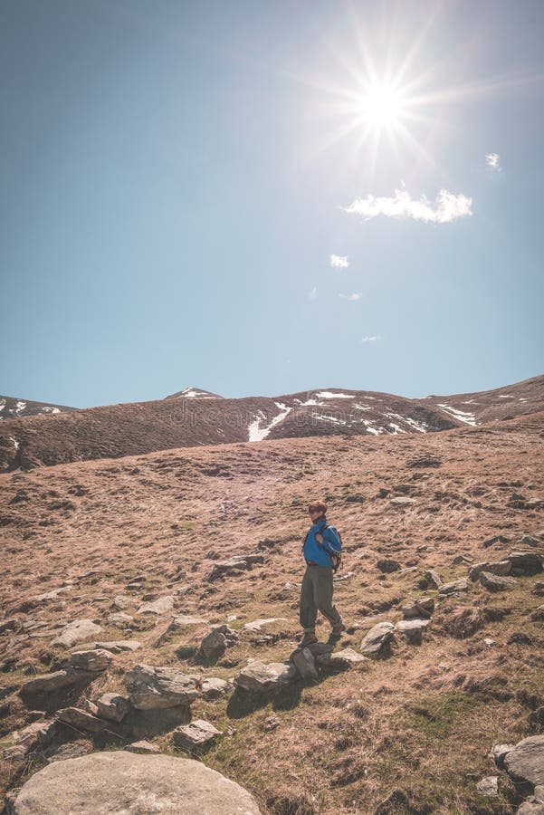 Backpacker Hiking in the Alps, Backlight, Toned Image Stock Photo ...