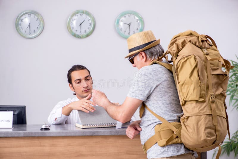 Backpacker at the Hotel Reception Stock Image - Image of backpacker ...