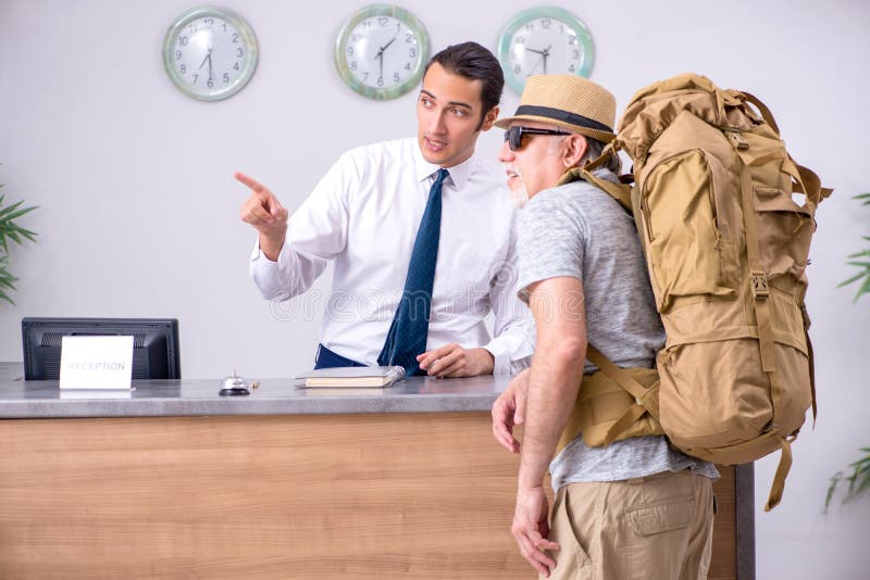 Backpacker at the Hotel Reception Stock Photo - Image of hotel ...