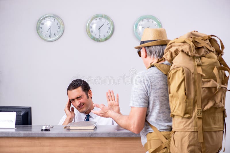 Backpacker at the Hotel Reception Stock Image - Image of backpacker ...