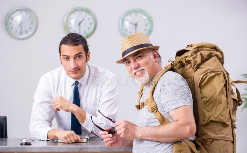 Backpacker at the Hotel Reception Stock Photo - Image of lobby, check ...