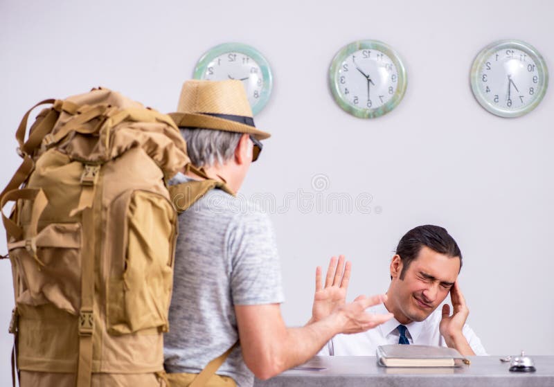 Backpacker at the Hotel Reception Stock Image - Image of backpacker ...