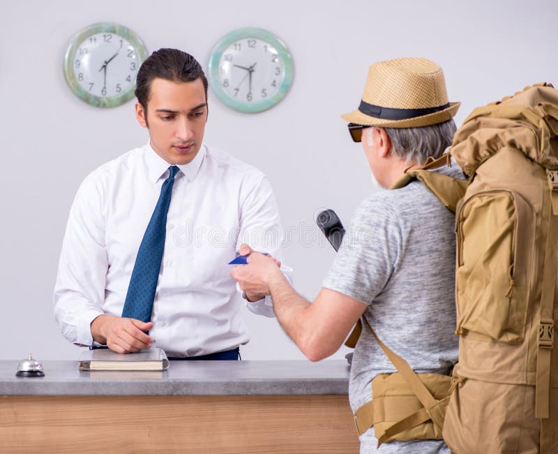 Backpacker at the Hotel Reception Stock Image - Image of arrival, hotel ...