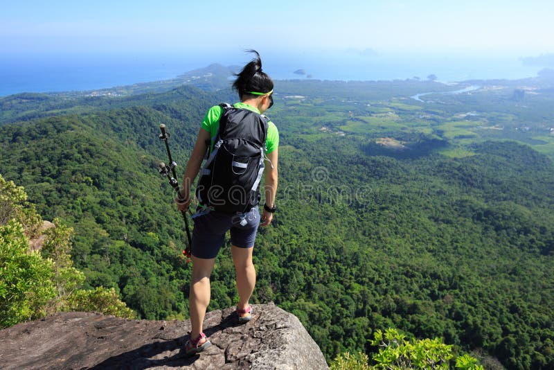 Backpacker Looking Down on Mountain Peak Cliff Stock Image - Image of ...
