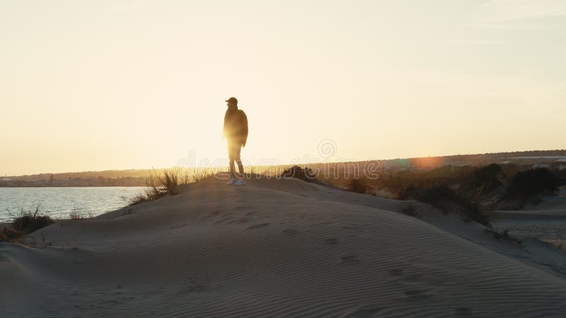 Backpacker Man on a Sand Dune at Sunset Stock Video - Video of nature ...