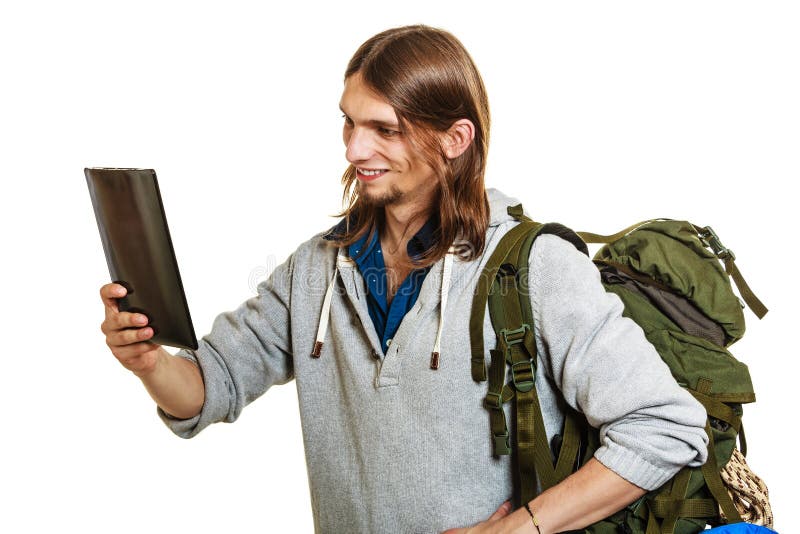 Backpacker Man Using Pc Tablet Browsing Internet. Stock Photo - Image ...