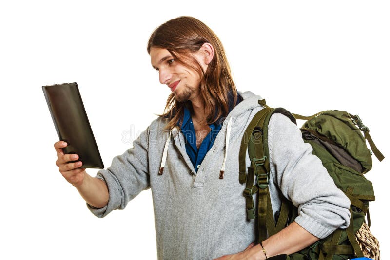 Backpacker Man Using Pc Tablet Browsing Internet. Stock Image - Image ...