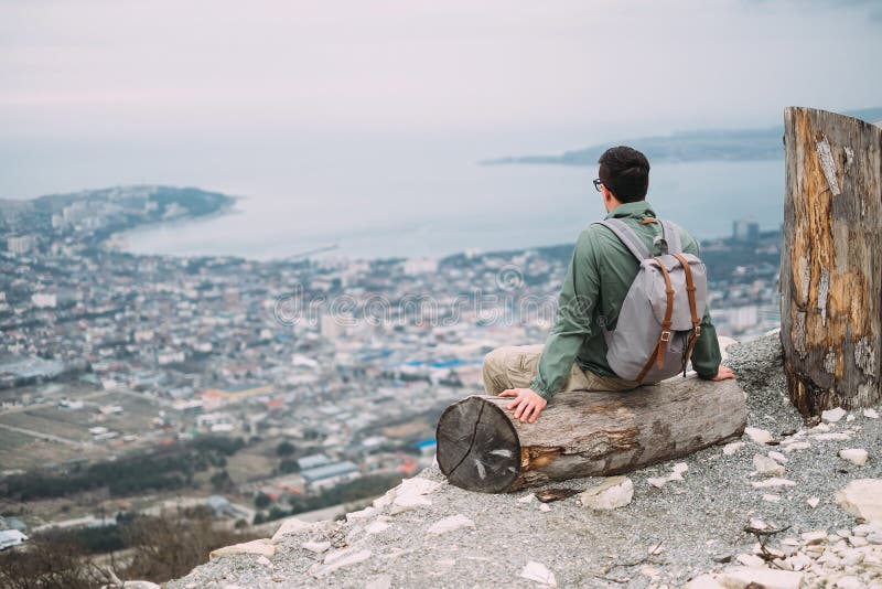 Backpacker Sitting on Tree Trunk Stock Photo - Image of resting ...