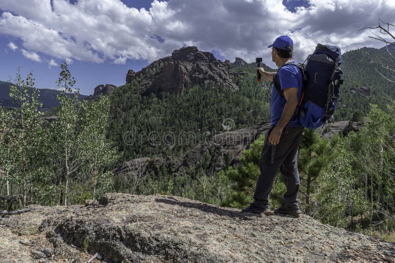 Backpacker Using Camera in Lost Creek Wilderness Stock Image - Image of ...