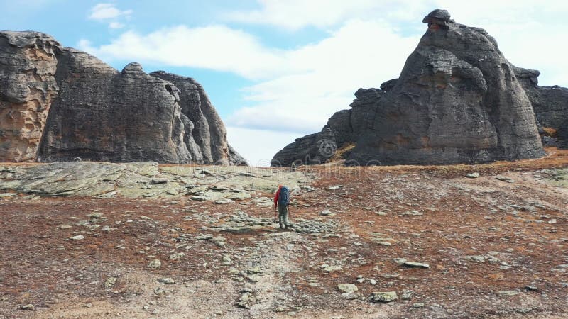 Backpacker Walking on Rocky Path Towards Mountain Pass Stock Video ...