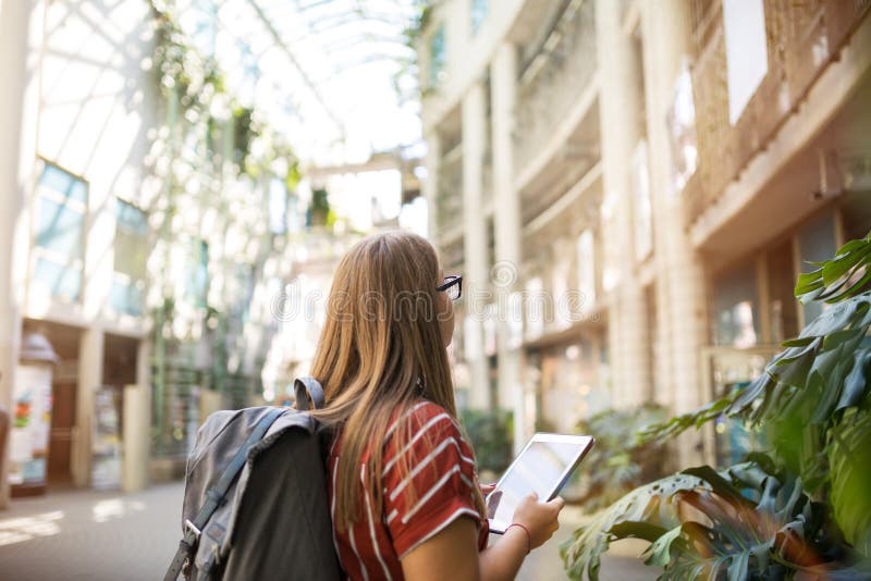 Young Woman Walking in the City and Using Tablet Pc Stock Photo - Image ...