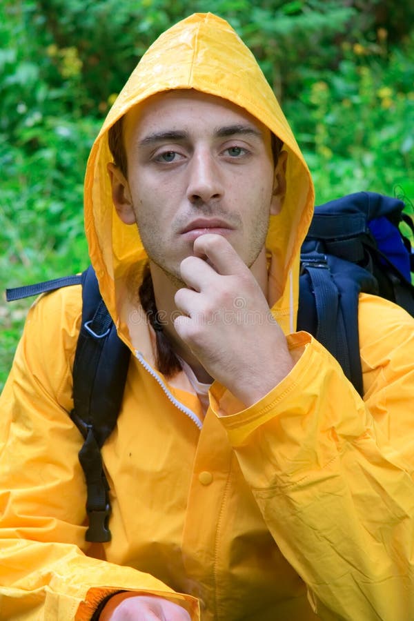 Backpacker in a Yellow Coat Resting Stock Photo - Image of active, fall ...