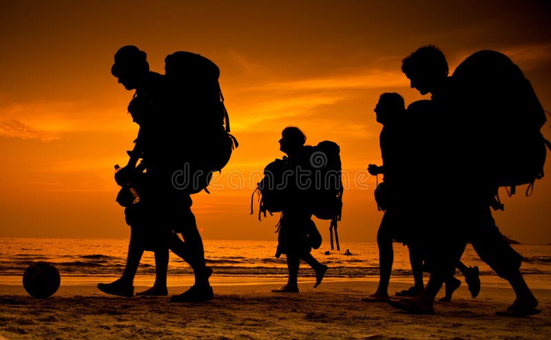 Backpackers on the beach stock image. Image of lights - 13149243