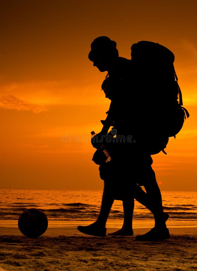 Backpackers on the beach stock image. Image of lights - 13149243