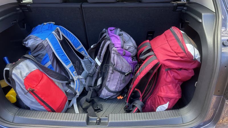 Backpacks in the car trunk stock photo. Image of auto - 308760976