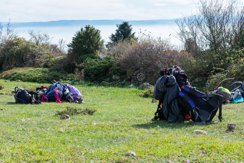 Backpacks of Hikers Resting on the Ground Stock Image - Image of field ...