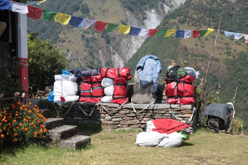 Backpacks on a Track in the Mountains of Nepal Stock Photo - Image of ...