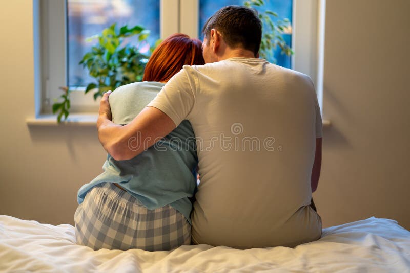 Backs Of Hugging Man And Woman Husband Comforts Calms Down Supporting
