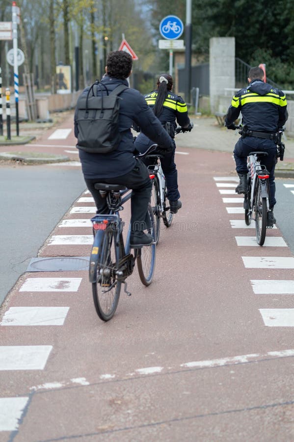 Backside Police on Bicycles at Amsterdam the Netherlands 11-12-2024 ...