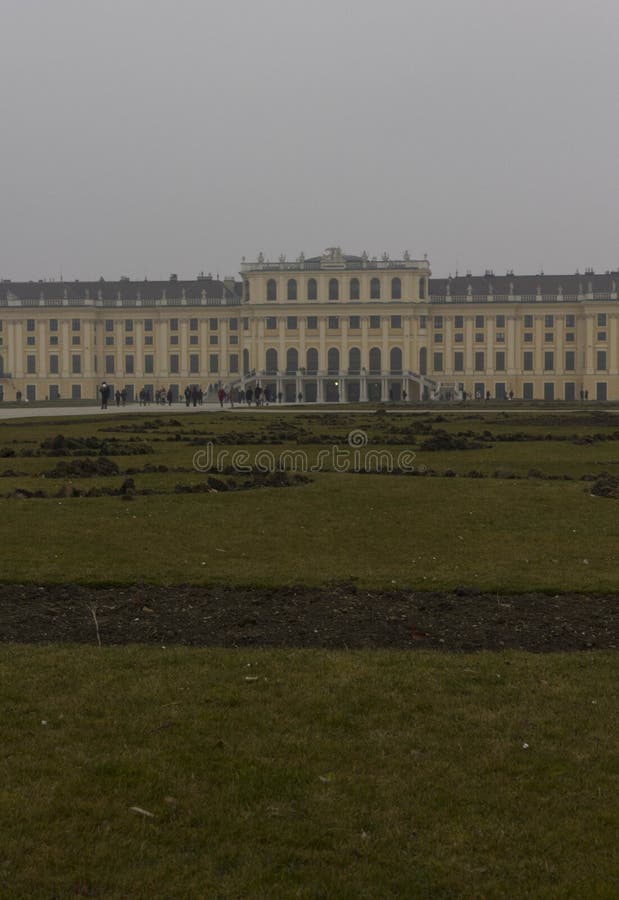 Backside Of Schonbrunn Palace With Its Garden In A Foggy Winter Day