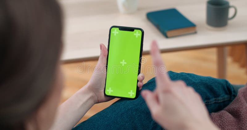 Backside View of Deaf Person Holding and Looking at Smartphone Green ...