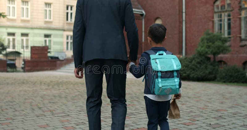 Backside View of Man in Suit Waiting for Son while Standing at Yard ...