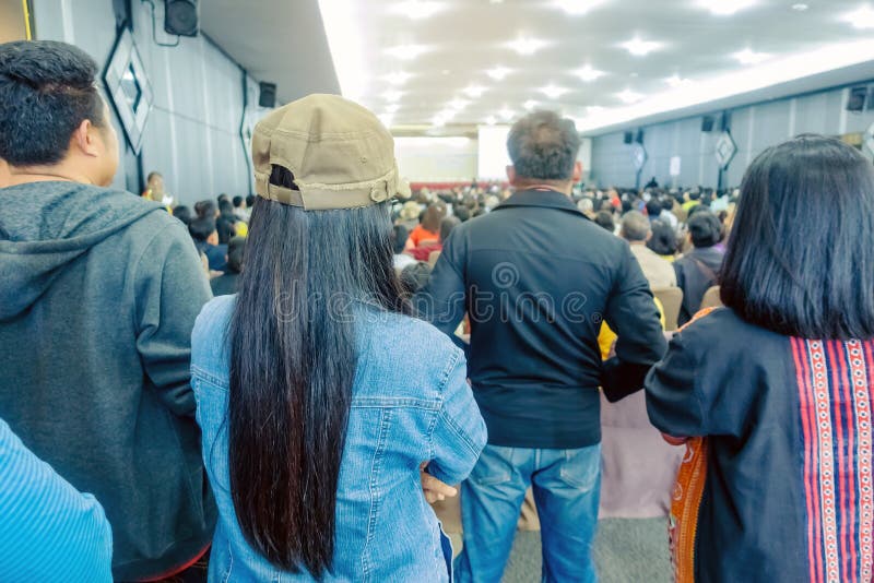 Backside View of Spectators Standing in a Gathering in the Back of ...