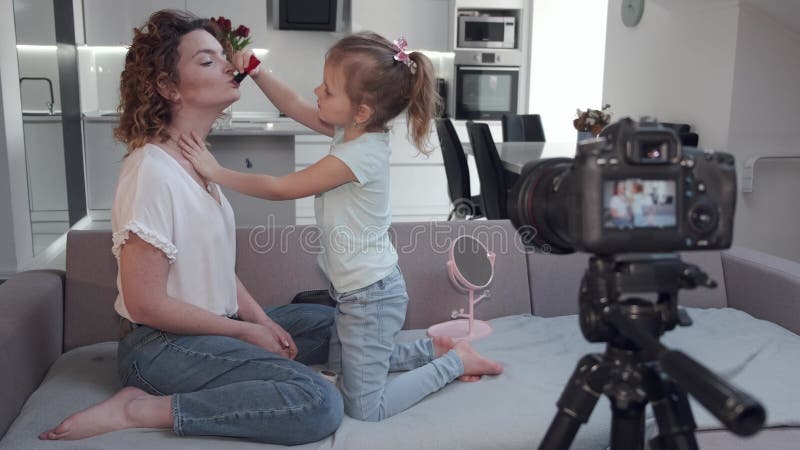 Backstage Of Photoshoot Of Daughter Doing Makeup For Mom At Home Stock