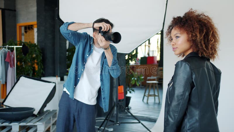 Backstage of Professional Photoshoot: Man Taking Picture of Young Model ...