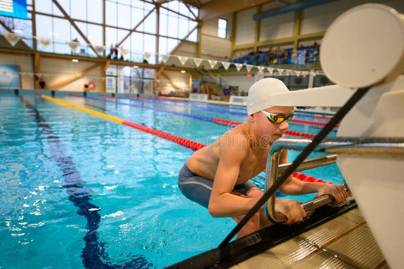 Backstroke Swimmer Boy Start from the Starting Table in the Pool Stock ...
