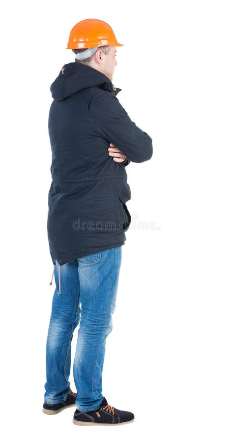 Backview of an Engineer in Construction Helmet Stands and Parka. Stock ...