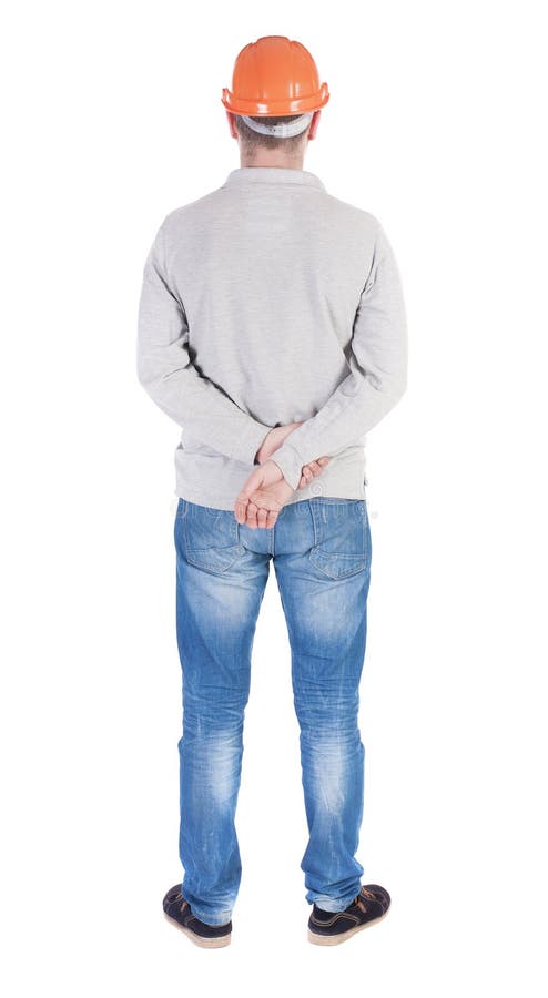 Backview of an Engineer in Construction Helmet Stands and Using Stock ...