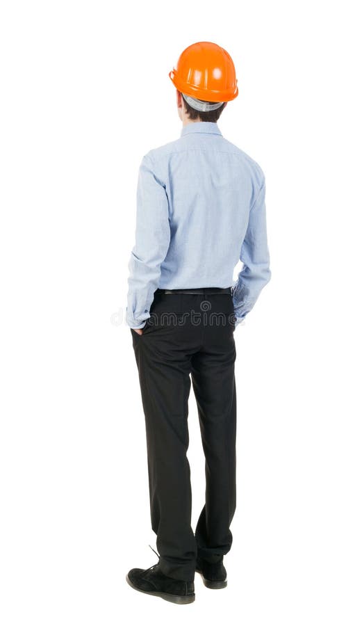 Backview of an Engineer in Construction Helmet Stands. Stock Photo ...