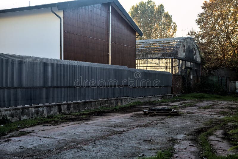 Backyard of an Abandoned Factory at Sunset in Autumn Stock Photo ...