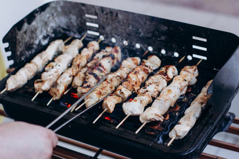 Backyard Barbecue. Man Cooks Chicken Meat on Grill Stock Photo - Image ...