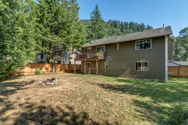 Backyard Exterior Home Real Estate with Fire Pit Daytime Mountains Blue ...