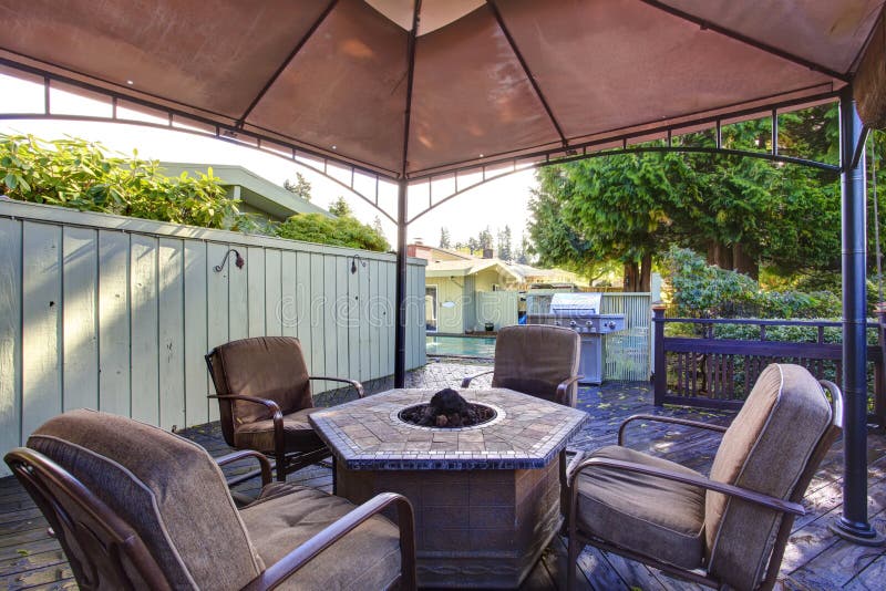 Backyard Gazebo with Patio Set Stock Image - Image of back, rental ...