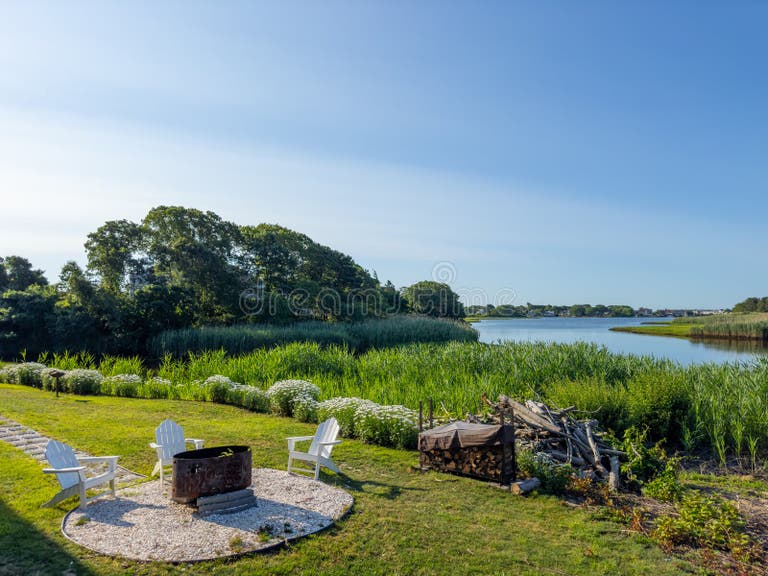 Backyard on a Lake with a Fire Pit Stock Photo - Image of nature, wood ...