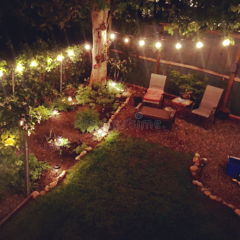 Backyard stock image. Image of patio, sitting, lights - 230394313