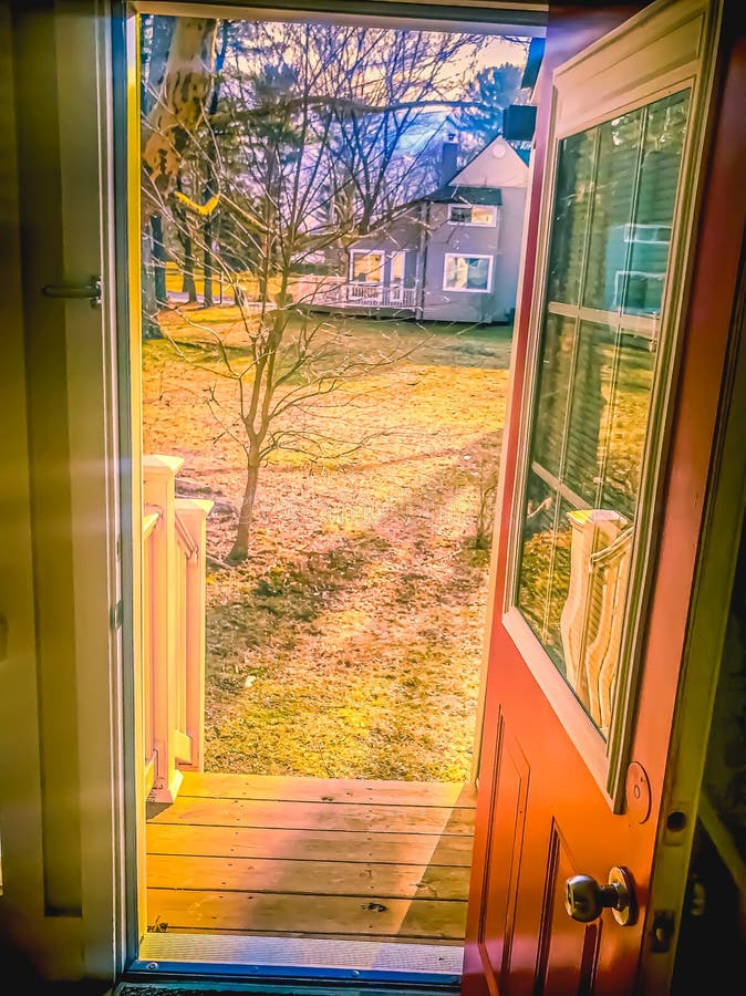 Backyard with Trees and a House in Background, Seen through an Opened ...