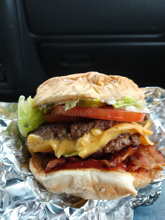 Bacon Cheeseburger with Lettuce and Tomato Stock Photo - Image of meat ...