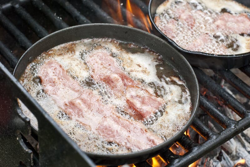 Bacon Cooking Over Campfire Stock Photo - Image of meal, iron: 56916810