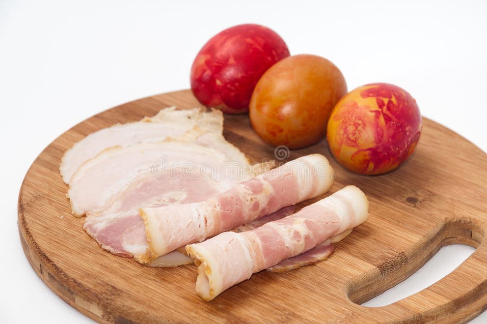Bacon Cut into Slices and Easter Eggs on a Wooden Board Stock Image ...