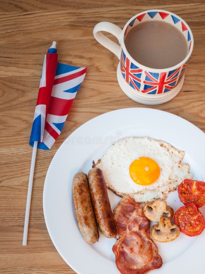 Bacon and Eggs with Cup of Tea, Toast and British Flag Behind Stock ...