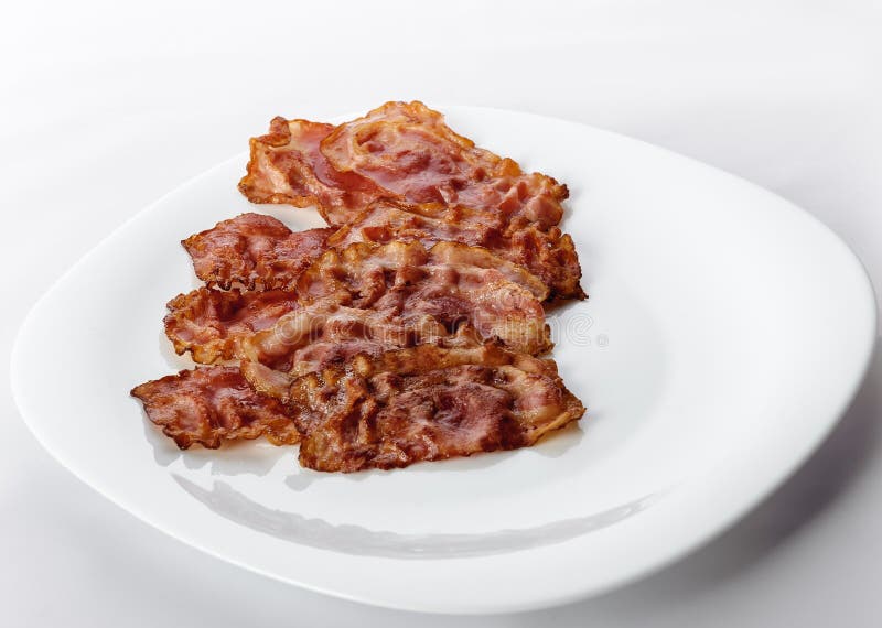 Bacon on a plate stock photo. Image of smoked, plate - 37857716