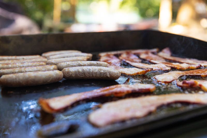 Bacon and Sausage Cooking on a Camp Grill Stock Image - Image of hash ...