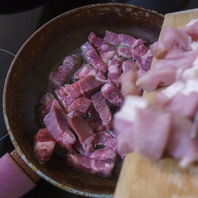 Bacon Slice Being Cooked in Frying Pan. Raw Red Bacon. Cooking Concept ...