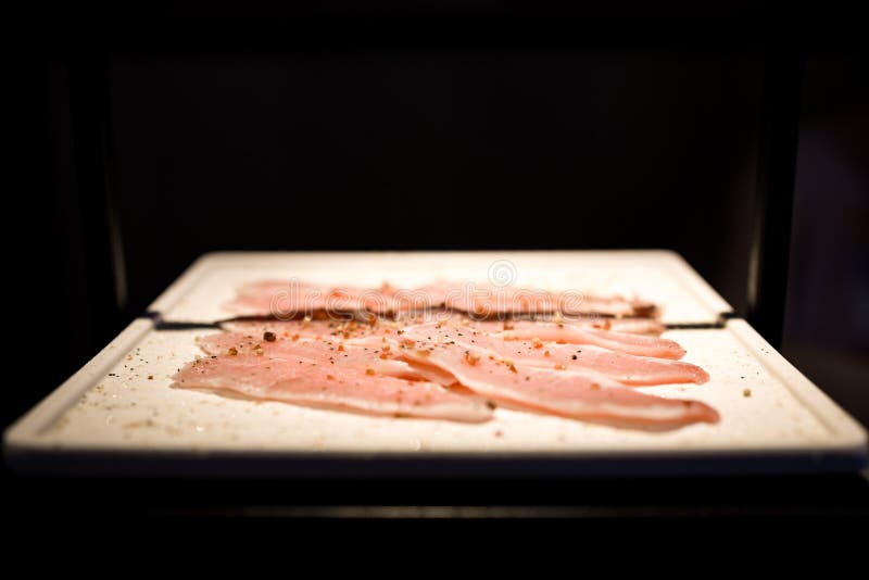 Bacon Slices on a Tray in the Oven Stock Photo - Image of recipe ...